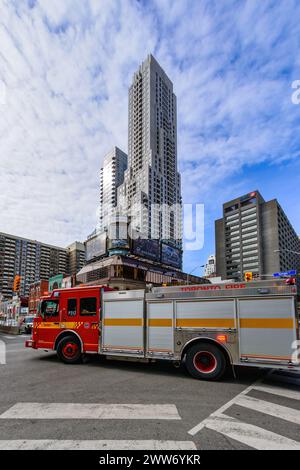 Fire truck of the Toronto Fire Department driving in the downtown ...