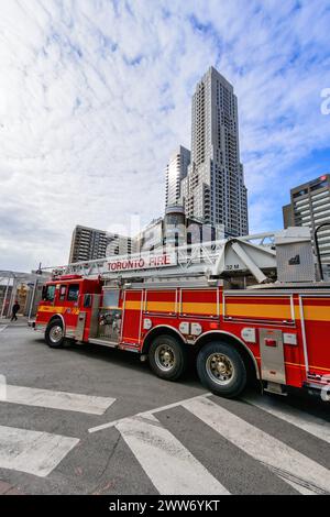 Fire truck of the Toronto Fire Department driving in the downtown ...