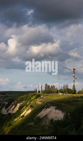 TV tower, mobile phone tower over countryside on sky background with ...