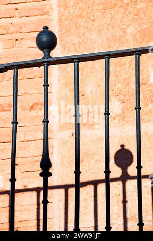 Handrail ball on railing with its shadow in San Carlos del valle Stock ...
