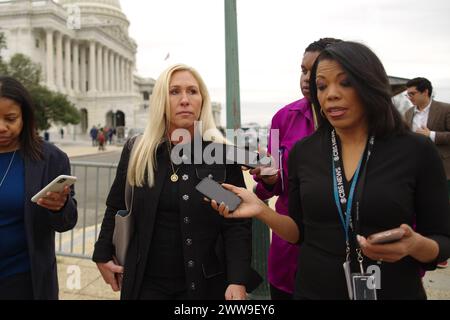 Rep. Marjorie Taylor Greene (R-Ga.) is seen in an elevator with aides ...