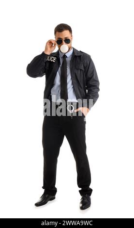 Police officer blowing gum Stock Photo - Alamy