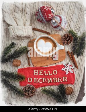 Hello December text. Winter composition with fir branches, cones and ...