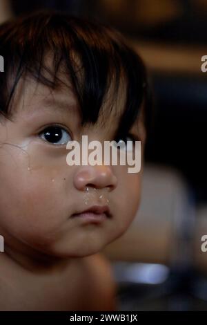 Crying boy with tear on cheek. Kid crying, focus on his tear Stock ...