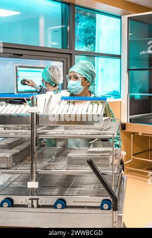 2 technicians checking the material entering the washing room before ...