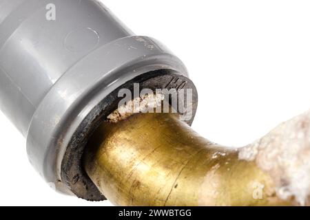 salt deposits on brass drain pipe close up isolated on white background ...
