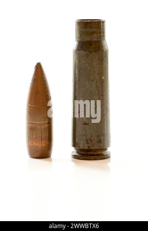 scratched ammunition for AK-47 on a white background Stock Photo - Alamy