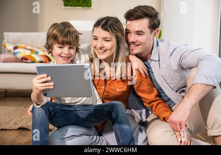 happy family with tablet pc computers at home Stock Photo - Alamy