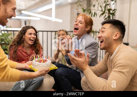 Cheerful group of workmates celebrating business success in startup ...
