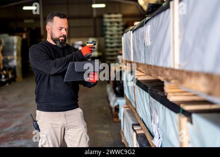 Dispatcher using tablet PC and scanning bar codes Stock Photo - Alamy