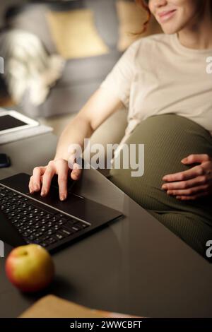 Young businesswoman at home office drinks coffee slowly reads plan in ...