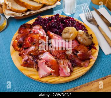 Sliced pork shank with braised cabbage Stock Photo - Alamy