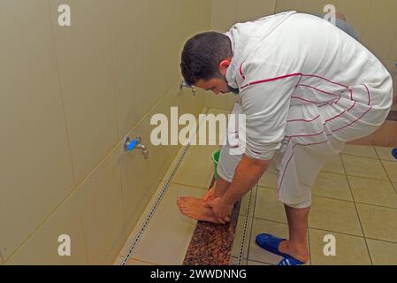 Muslim people wash their feet before entering in mosque in Istanbul ...