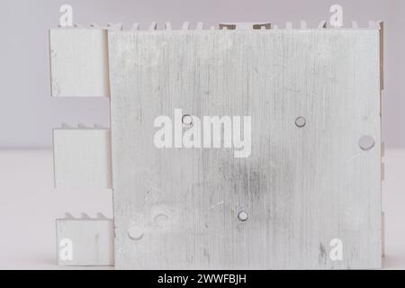 Closeup of mounting surface of rectangle aluminum heat sink on white ...