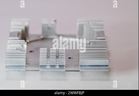 Closeup of fins of rectangle aluminum heat sink on white background ...
