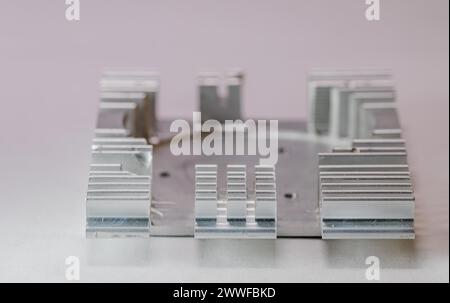 Closeup of fins of rectangle aluminum heat sink on white background ...