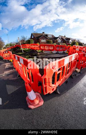 Fish-eye view of protected roadworks on a suburban residential street ...