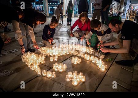 Members of the World Wildlife Foundation (WWF) are seen lighting ...