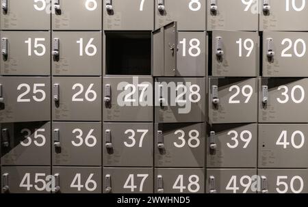 numbered steel lockers with combination locks Stock Photo - Alamy