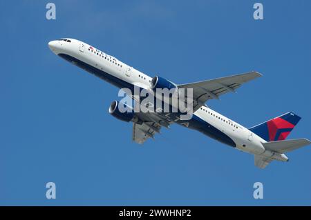 Delta Airlines Boeing 757 at LAX airport connected to jet bridge aerial ...