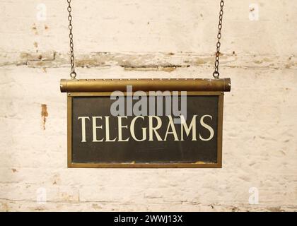 An antique 1920s brass and glass English Telegrams sign Stock Photo - Alamy