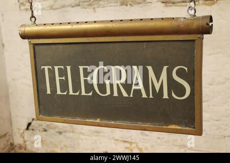 An antique 1920s brass and glass English Telegrams sign Stock Photo - Alamy