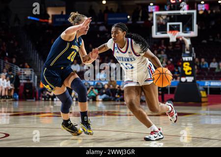 Michigan guard Jordan Hobbs (10) works toward the basket as Minnesota ...