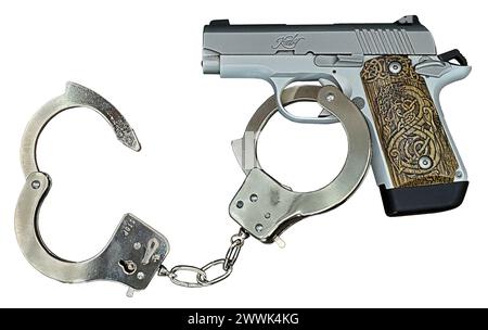 Silver metal gun with Celtic Engraved grip Stock Photo - Alamy