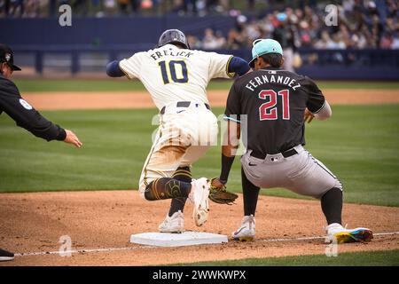 Milwaukee Brewers' Sal Frelick steals second base ahead of the throw to ...
