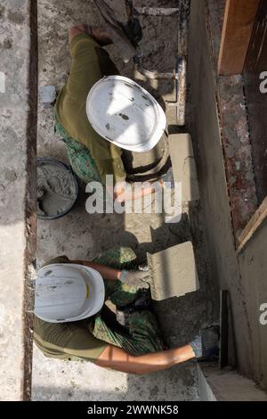 Members of the Singapore Army with the 30th Combat Engineer Brigade ...