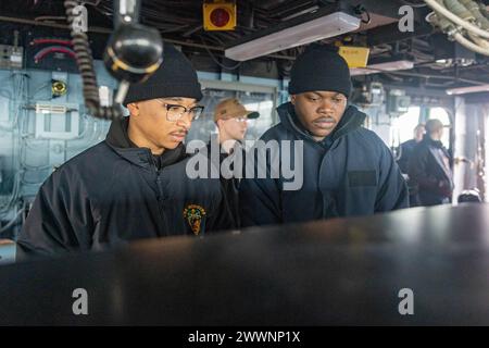 PHILIPPINE SEA (Feb. 1, 2024) Seaman Recruit Elijah Mawuli stands watch ...