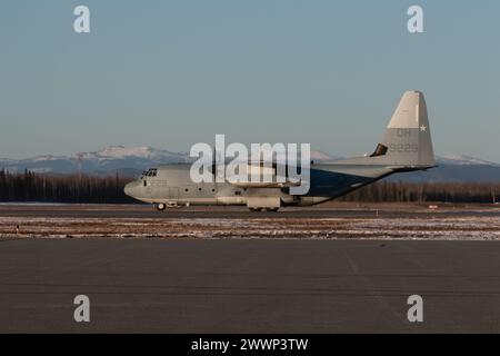 A C-130J Hercules, carrying a M142 High Mobility Artillery Rocket ...