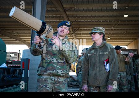 Maj. Gen. Stacy Huser (right), 20th Air Force commander, learns about ...