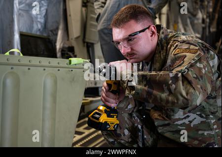 A 46-man life raft rigid container sits onboard a C-17 Globemaster III ...