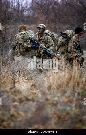 U.S. Army 6th Ranger Training Battalion members, carry a simulated ...
