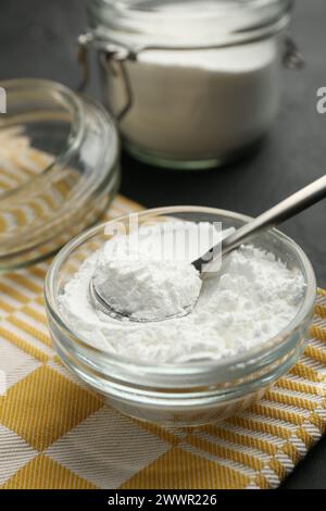 Bowl, spoon and jar with baking soda on wooden background Stock Photo ...