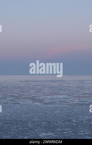 Small ice formations partially frozen at the ocean's edge Stock Photo ...