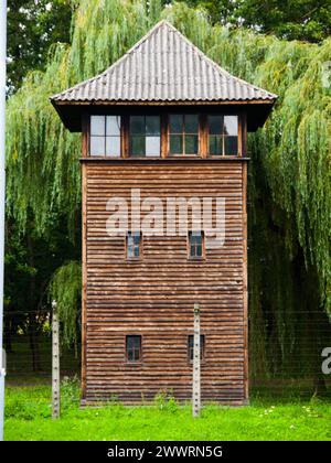 Wooden guard tower behind the fence of prison Stock Photo - Alamy