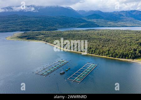 Aerial view of a salmon farm south of Puyuhuapi, rectangular cages ...