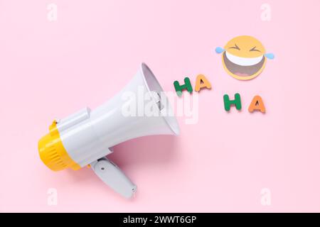Megaphone with text HA HA on pink background. April Fools Day ...
