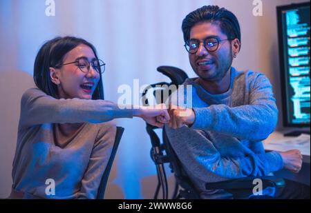 asian and Indian Developer team clapping hand for project success with ...