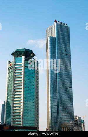 Two impressive high-rise towers stand tall, connected by a sleek sky ...