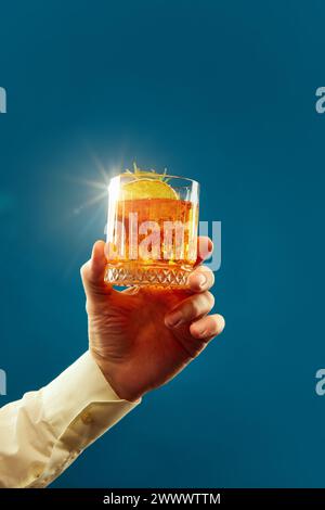 Woman hold bottle of beer against black background Stock Photo - Alamy