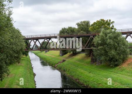 large sewer and power lines in industrial area Stock Photo - Alamy