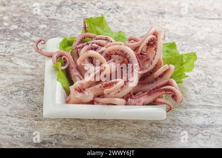 Marinated squid tentacles in the bowl for snack or salad Stock Photo ...