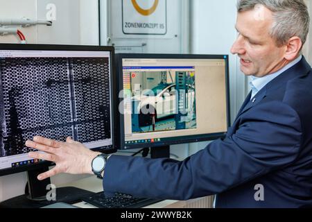 26 March 2024, Bavaria, Fürth: An electric vehicle stands under the ...