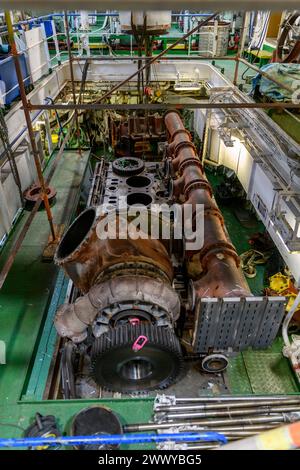 Main engine repairing. Inside engine room on big ship. Marine engine on ...