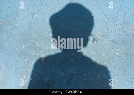 Shadow cast on a wall by an unidentified person. Texture Stock Photo ...