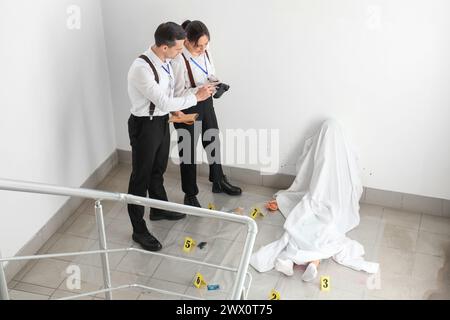 FBI agents working at crime scene with dead body Stock Photo - Alamy