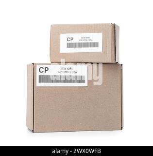 Cardboard packages with shipping labels and barcodes on white ...